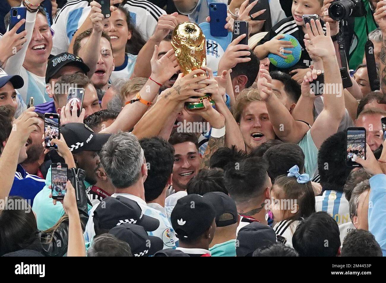 Argentina's Julian Alvarez lifts the FIFA World Cup trophy following ...