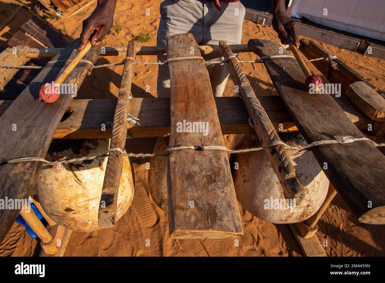 Drummer playing traditional african culture herigate bass mbila ...