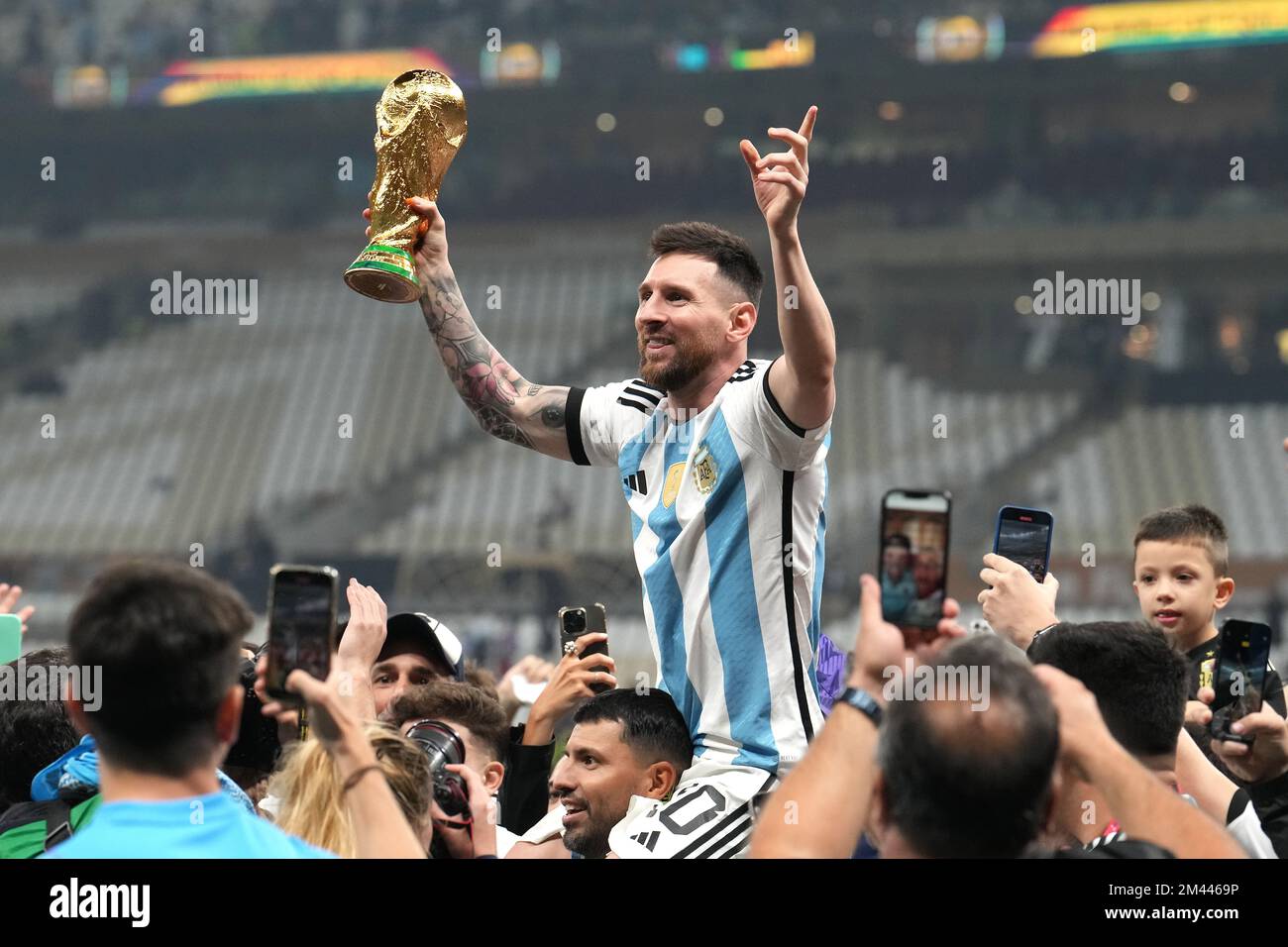Argentina captain Lionel Messi celebrate with the FIFA World Cup Trophy ...