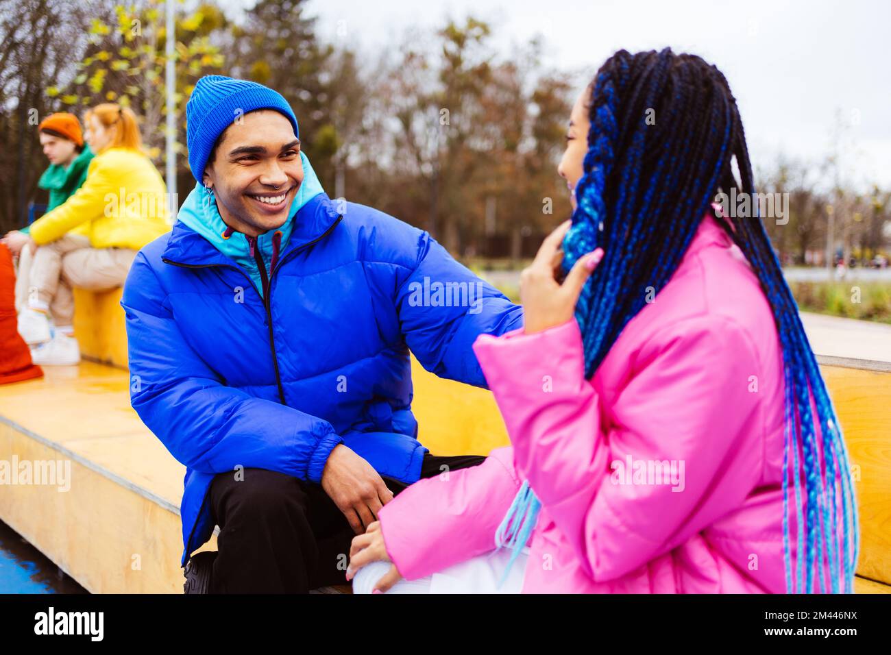 Multiracial young couple of lovers dating outdoors in winter, wearing ...