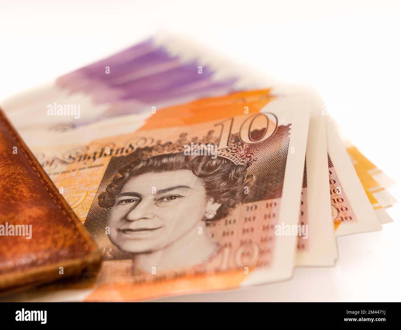 a light brown leather wallet with bank cards and a detailed close-up of ...