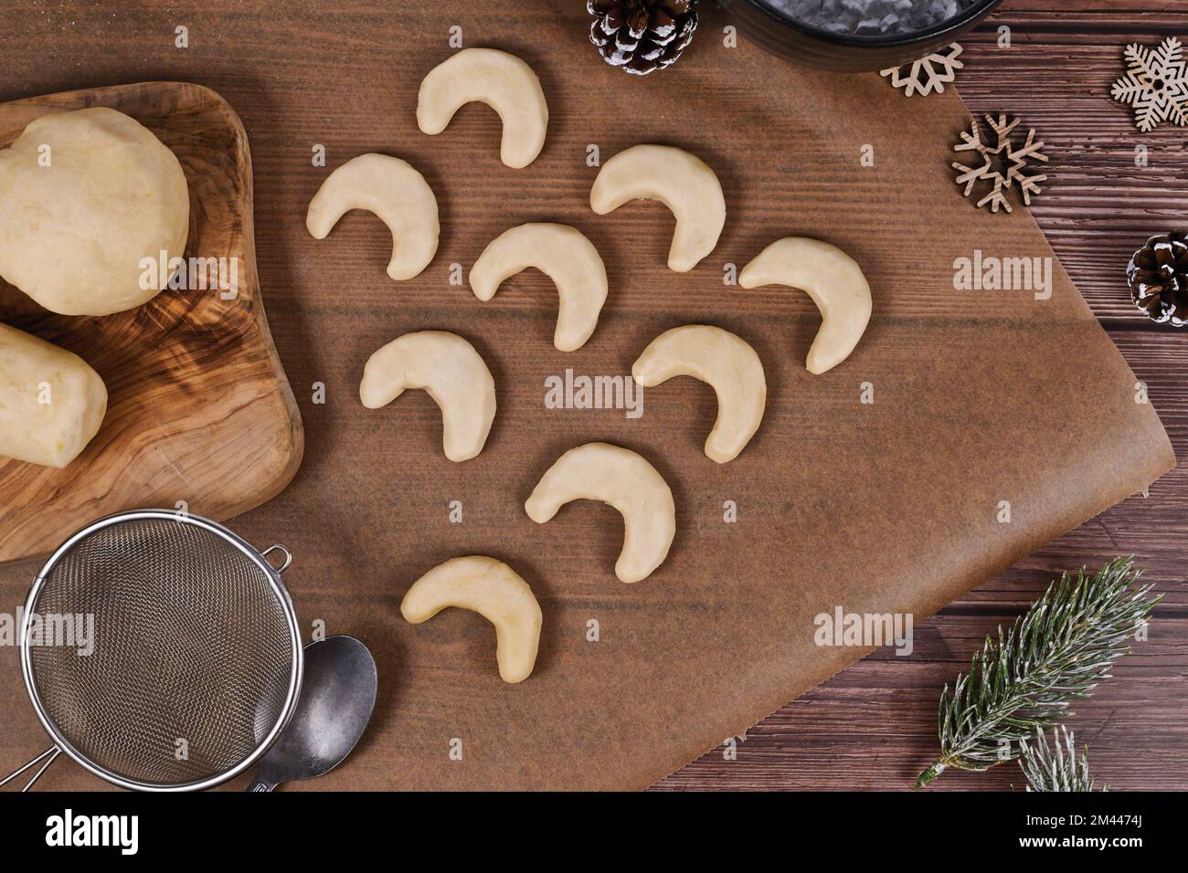 Baking traditional German or Austrian crescent shaped christmas cookies ...