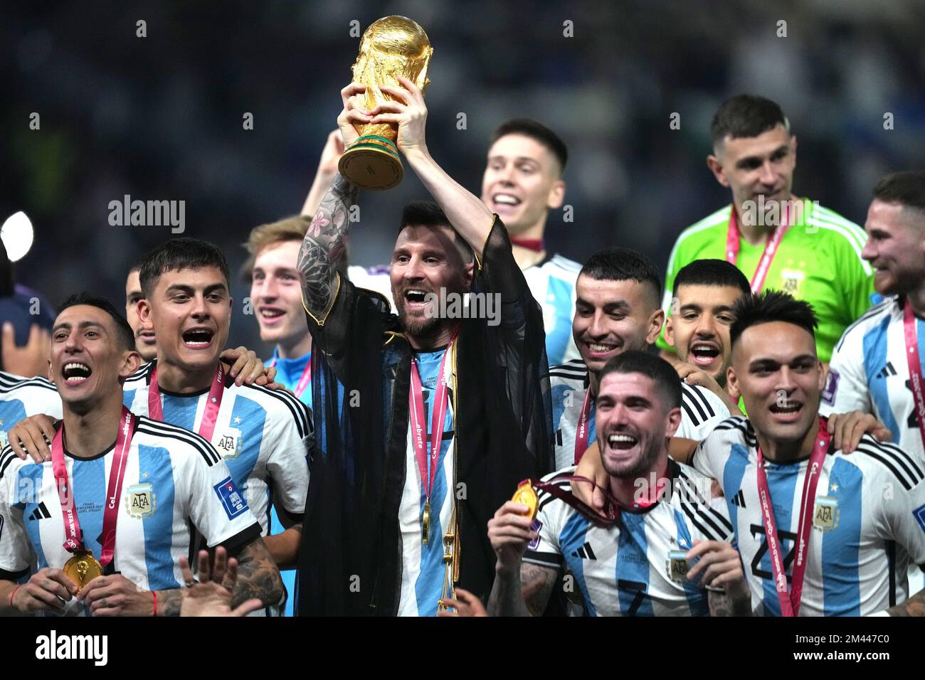 Argentina captain Lionel Messi lifts the FIFA World Cup trophy ...