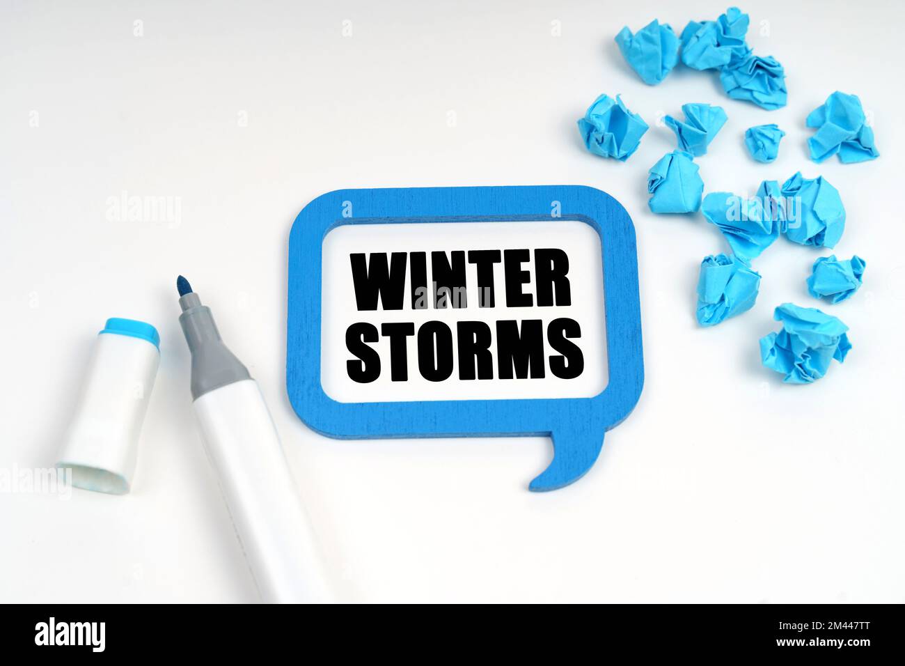 Medicine and health. On a white surface are crumpled blue paper, a ...