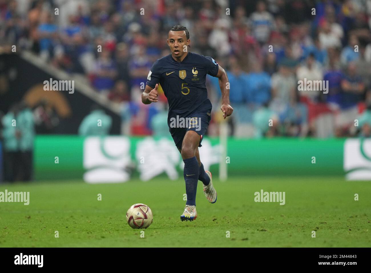 LUSAIL, QATAR - DECEMBER 18: Player of France Jules KoundÃ© controls ...