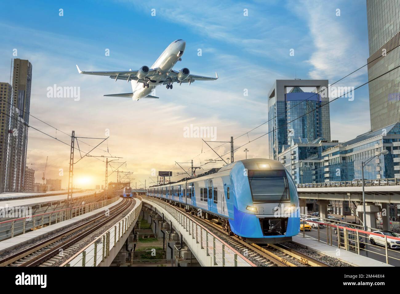 Urban view of railway tracks and suburban electric trains rushing along ...