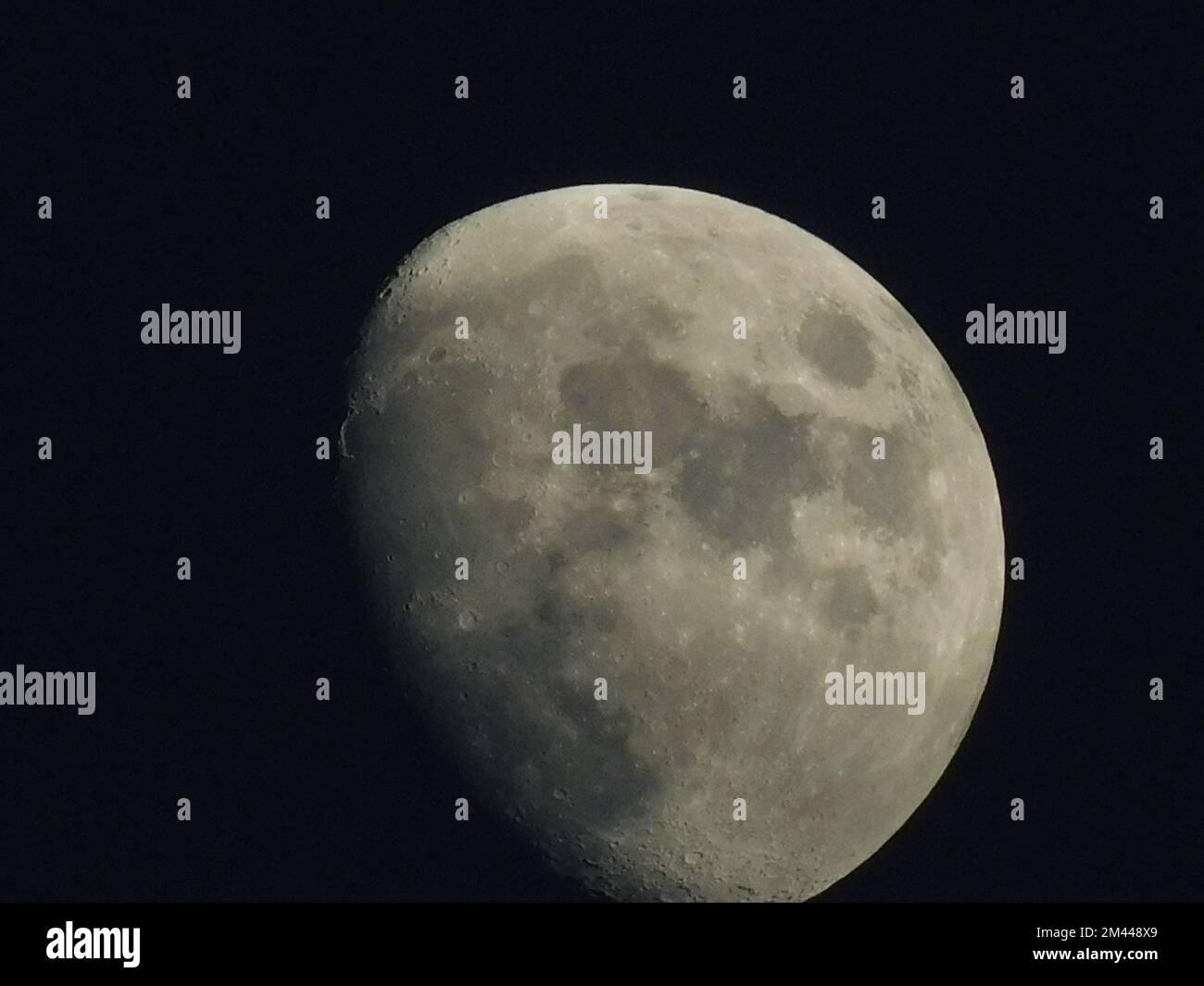 A beautiful view of the waxing gibbous moon on a dark background Stock ...