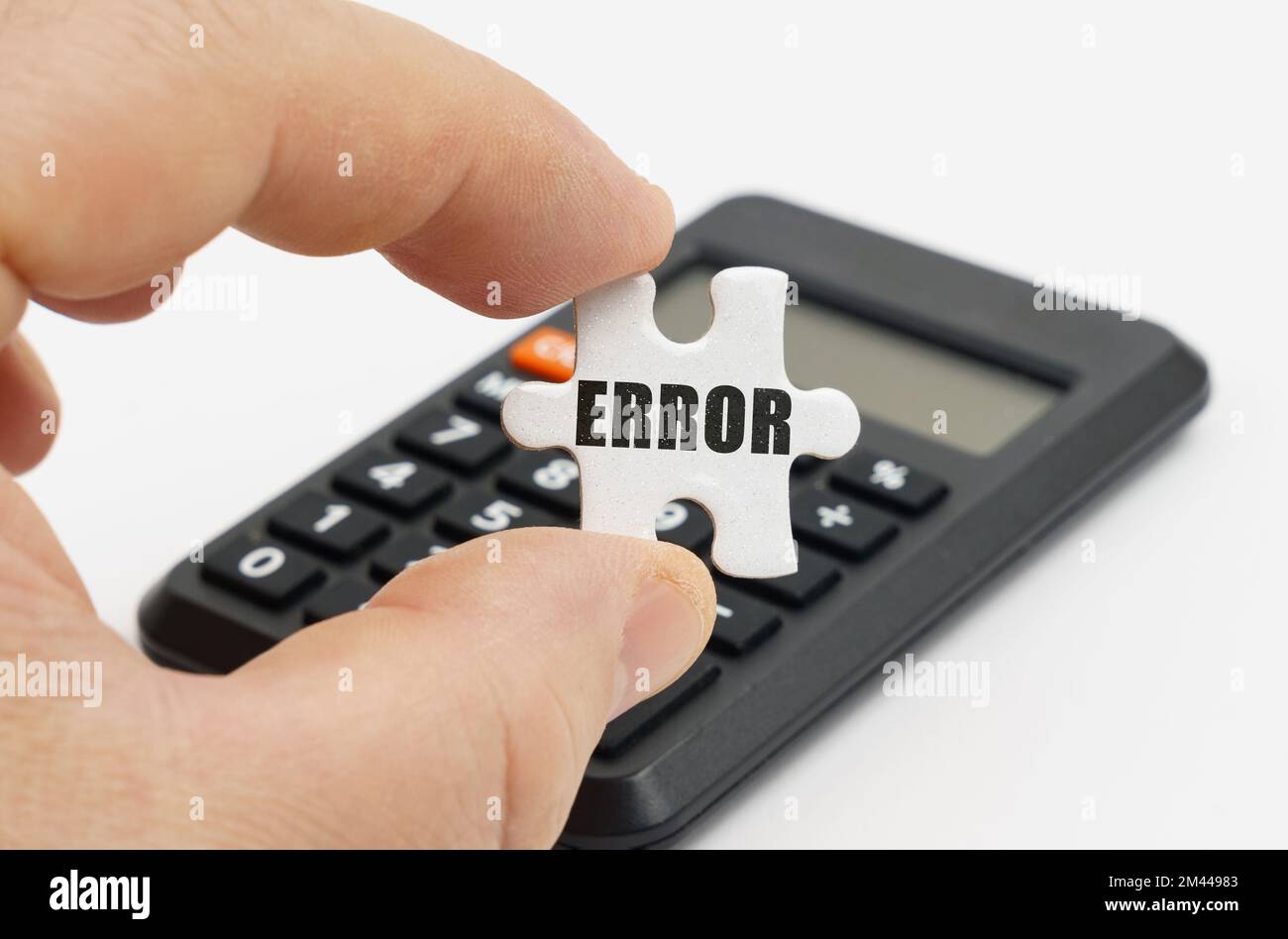 Economy and finance concept. A man holds in his hands a puzzle with the ...