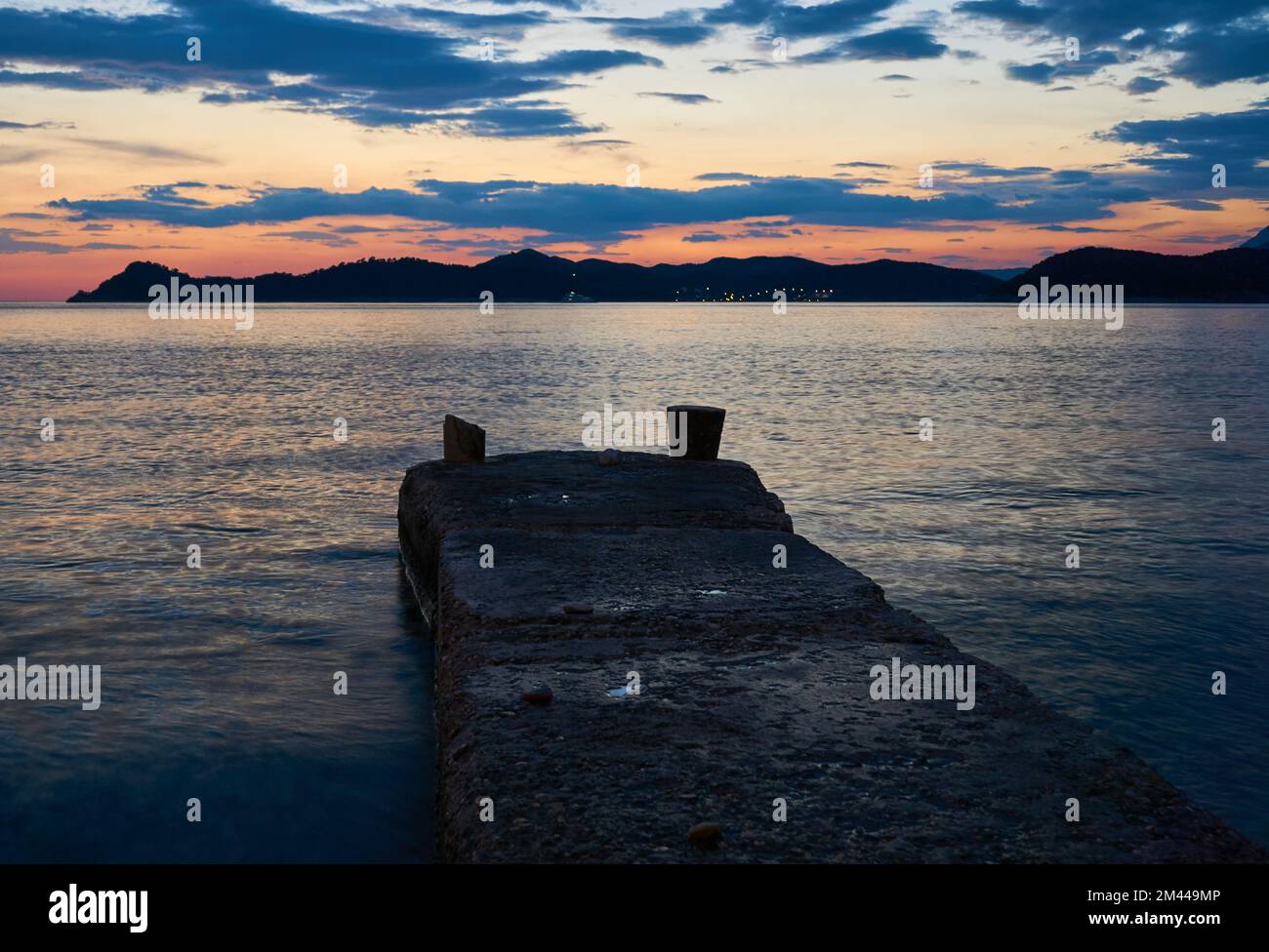 A closeup view of a pier during a beautiful sunset Stock Photo - Alamy