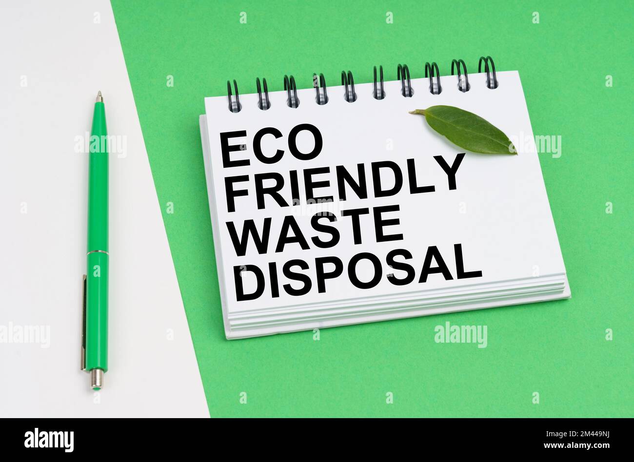 Ecological concept. On a white-green background lies a pen and a ...