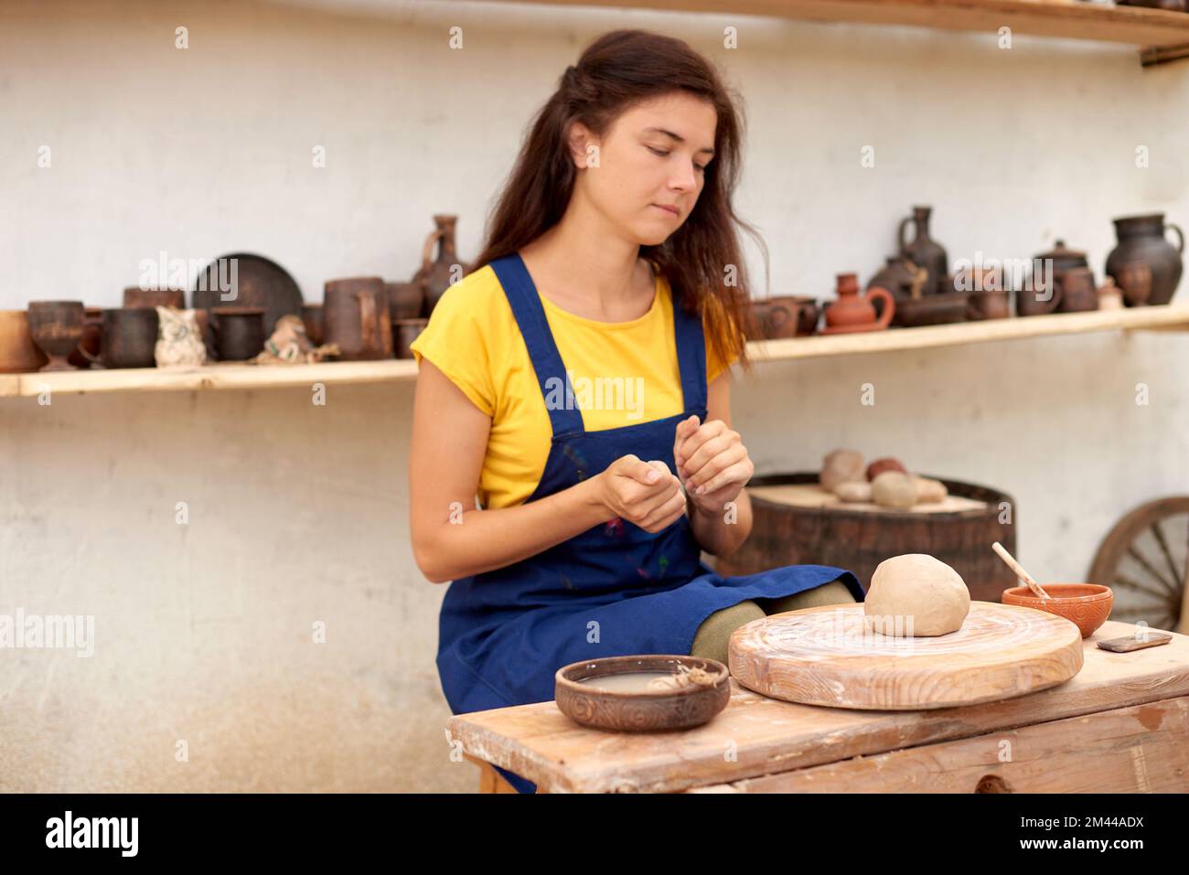 creating right sphere shape from clay for the manufacture of pottery ...