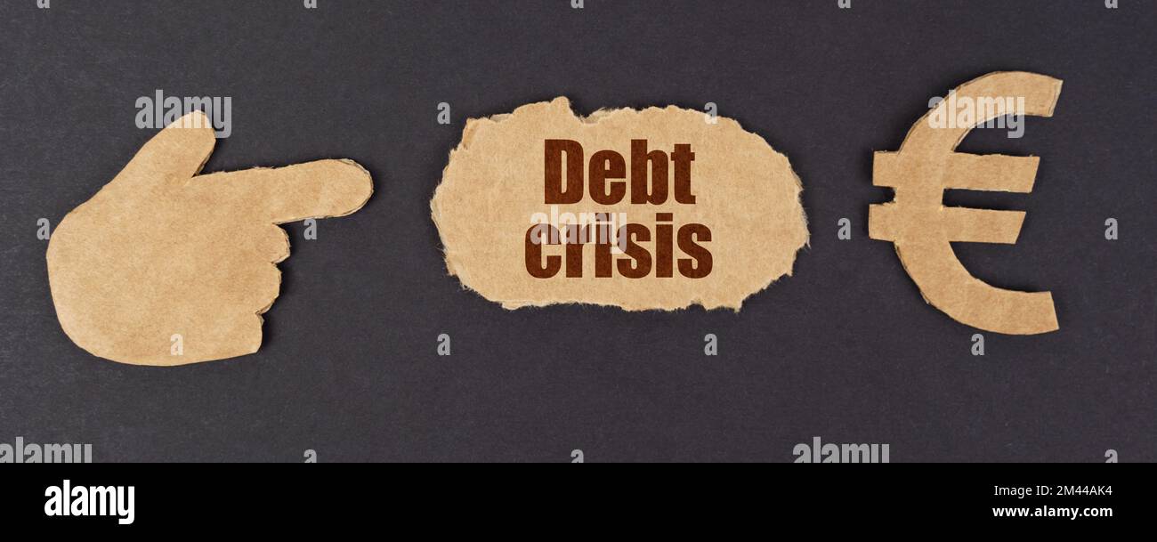 Economy and finance concept. On a black surface, a figure of a hand, a ...