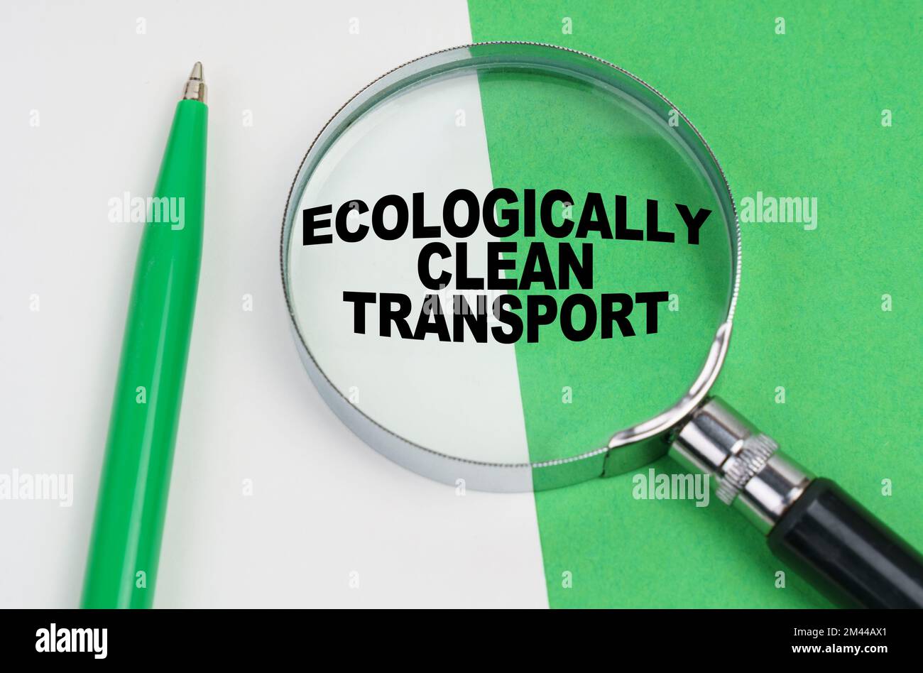 Ecological concept. On a white-green background lies a pen and a ...