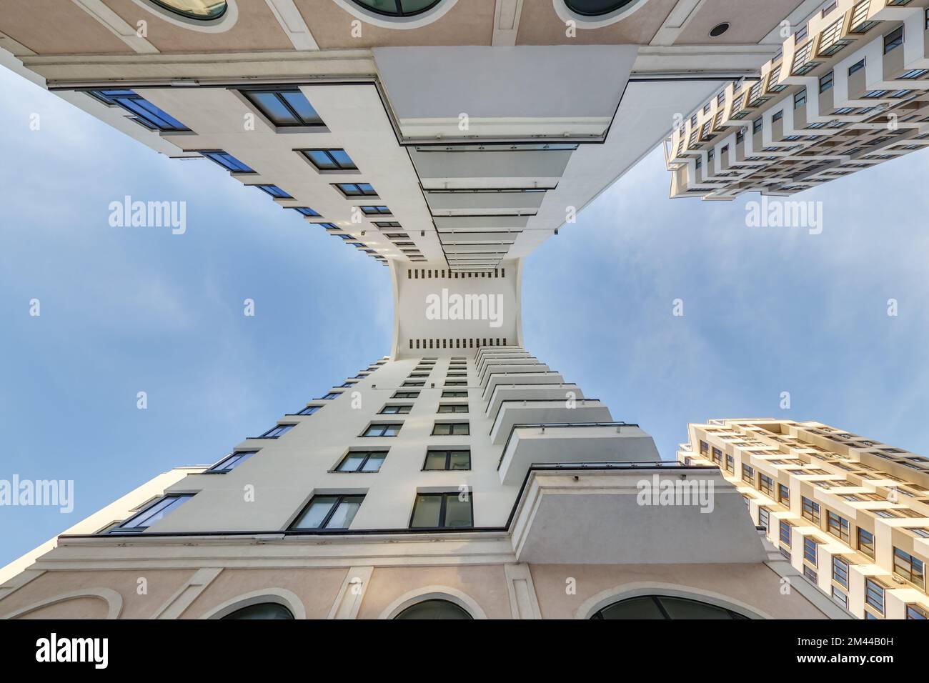 view up from ground to blue sky among skyscrapers, look at house from ...