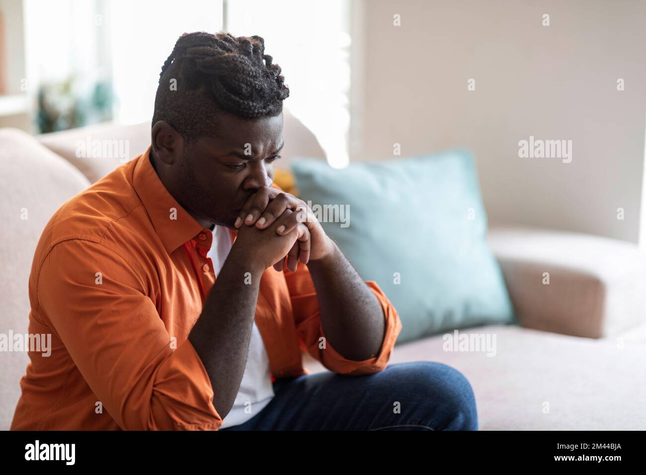 Sad lonely young black man hi-res stock photography and images - Alamy