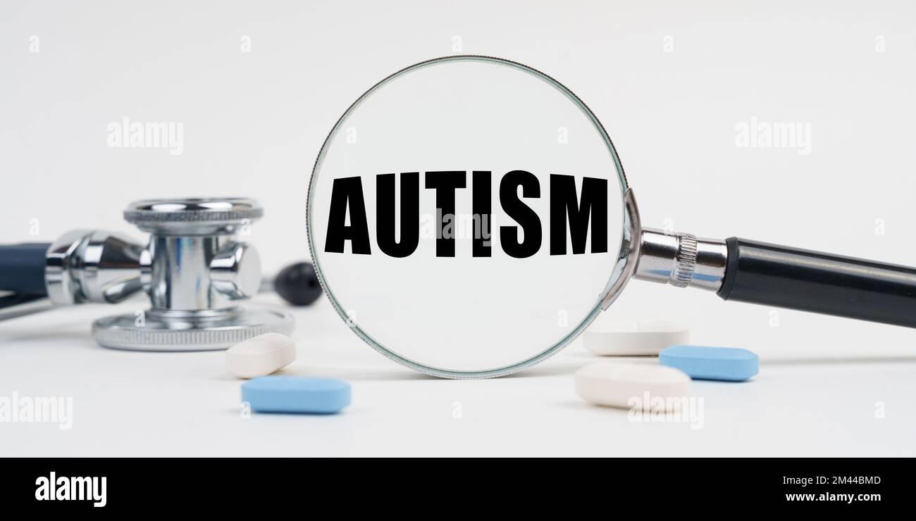 Medicine and health concept. On a white surface lie pills, a ...