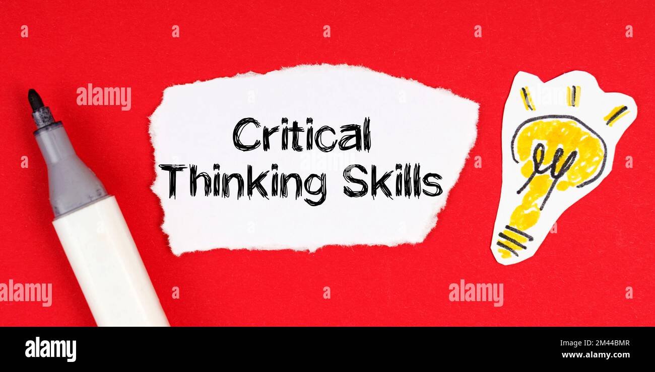 Business concept and idea. On a red surface lie a marker, a drawing of ...