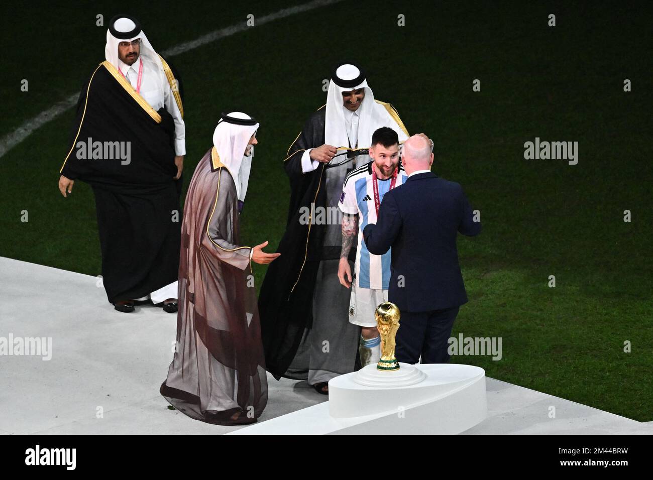 Doha, Qatar on December 18, 2022. Lionel Messi of Argentina receives a ...