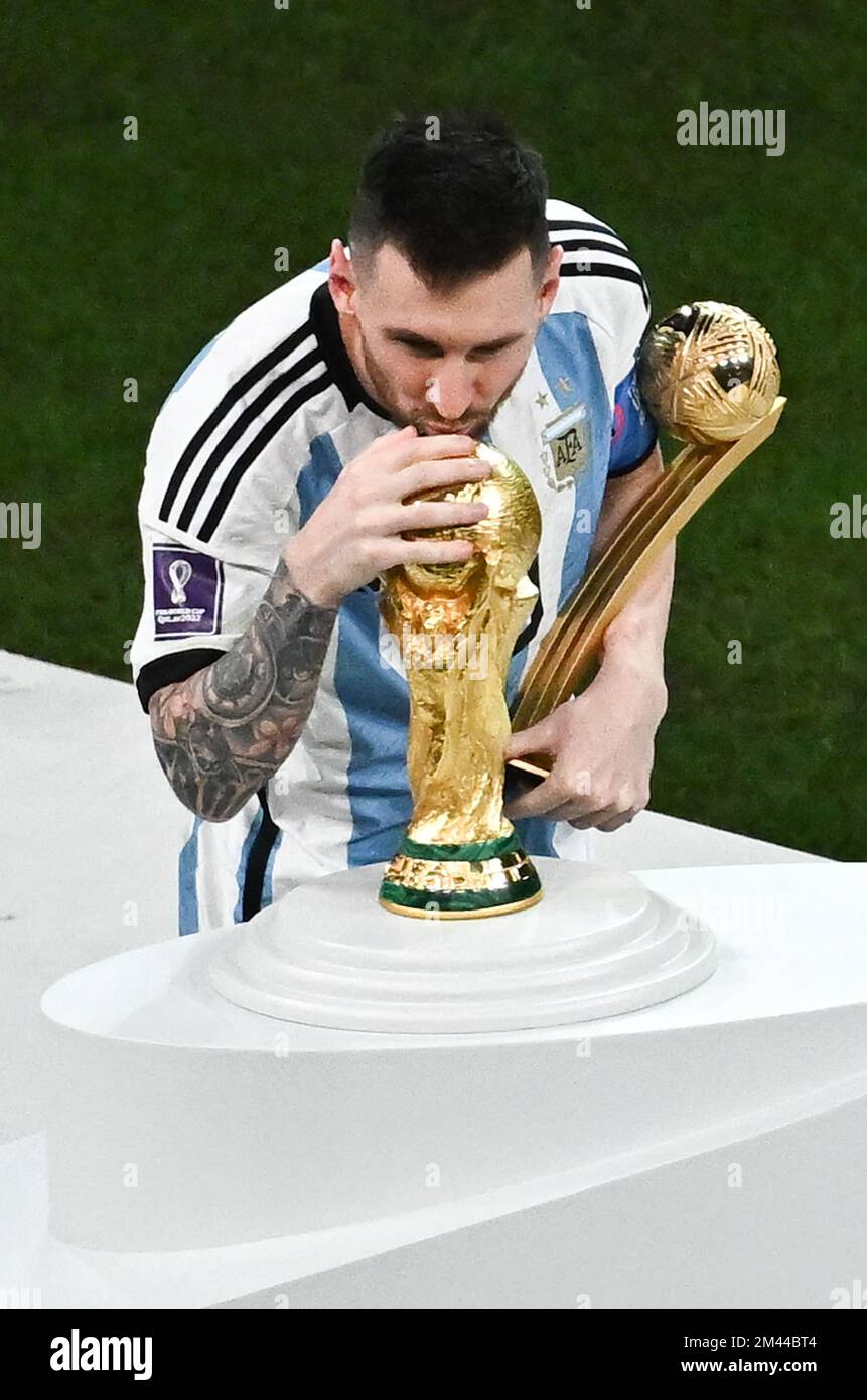 Doha, Qatar on December 18, 2022. Lionel Messi kisses the FIFA World ...