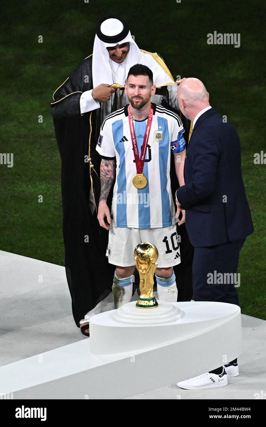 Doha, Qatar on December 18, 2022. Lionel Messi of Argentina receives a ...
