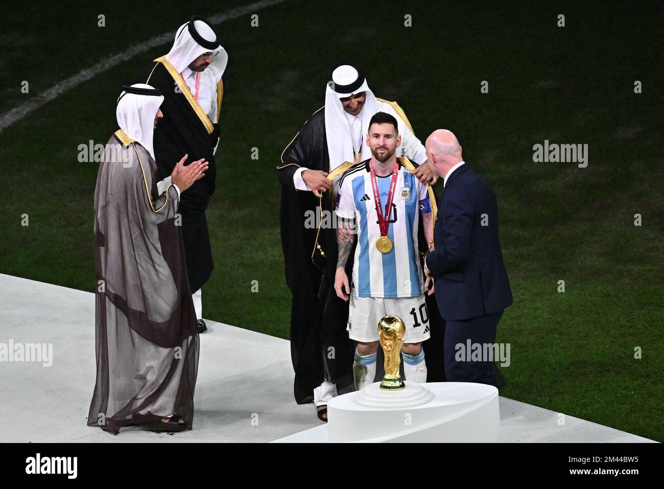 Doha, Qatar on December 18, 2022. Lionel Messi of Argentina receives a ...