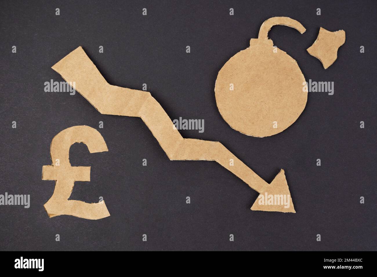 Concept of economic crisis. On a black surface, a graph with a down ...