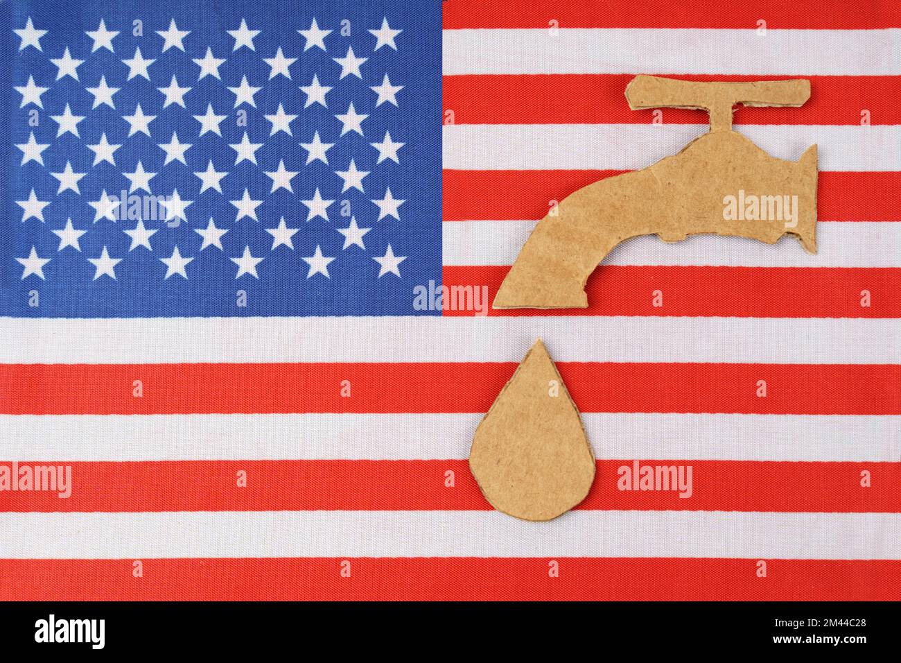 The concept of saving water resources. On the US flag, the figure of a ...