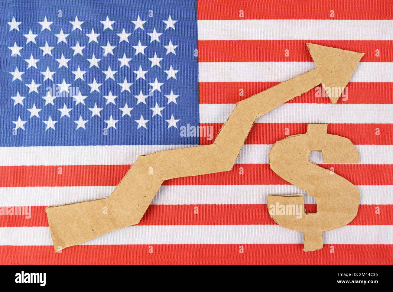 The concept of economic growth. The US flag has an arrow and a dollar ...