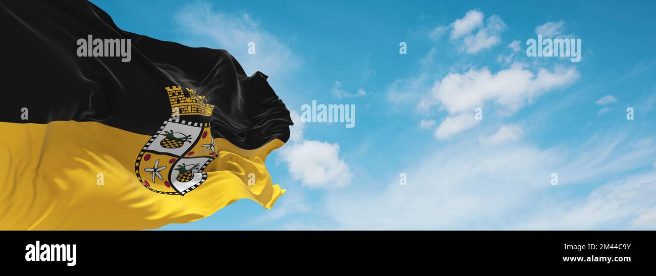 official flag of Yauco, Puerto Rico untied states of America at cloudy ...