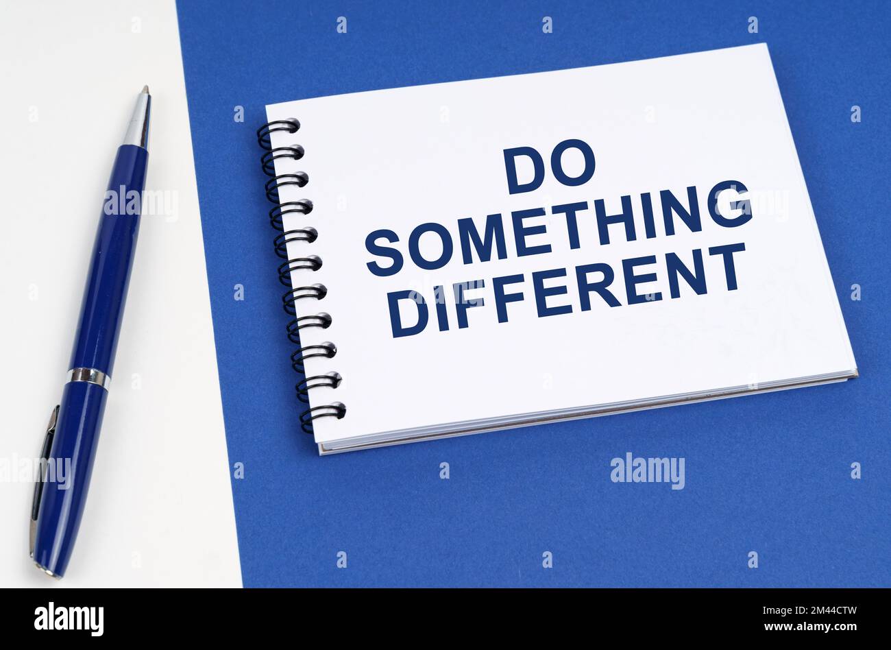 Business and finance concept. On a blue-white surface lies a pen and a ...