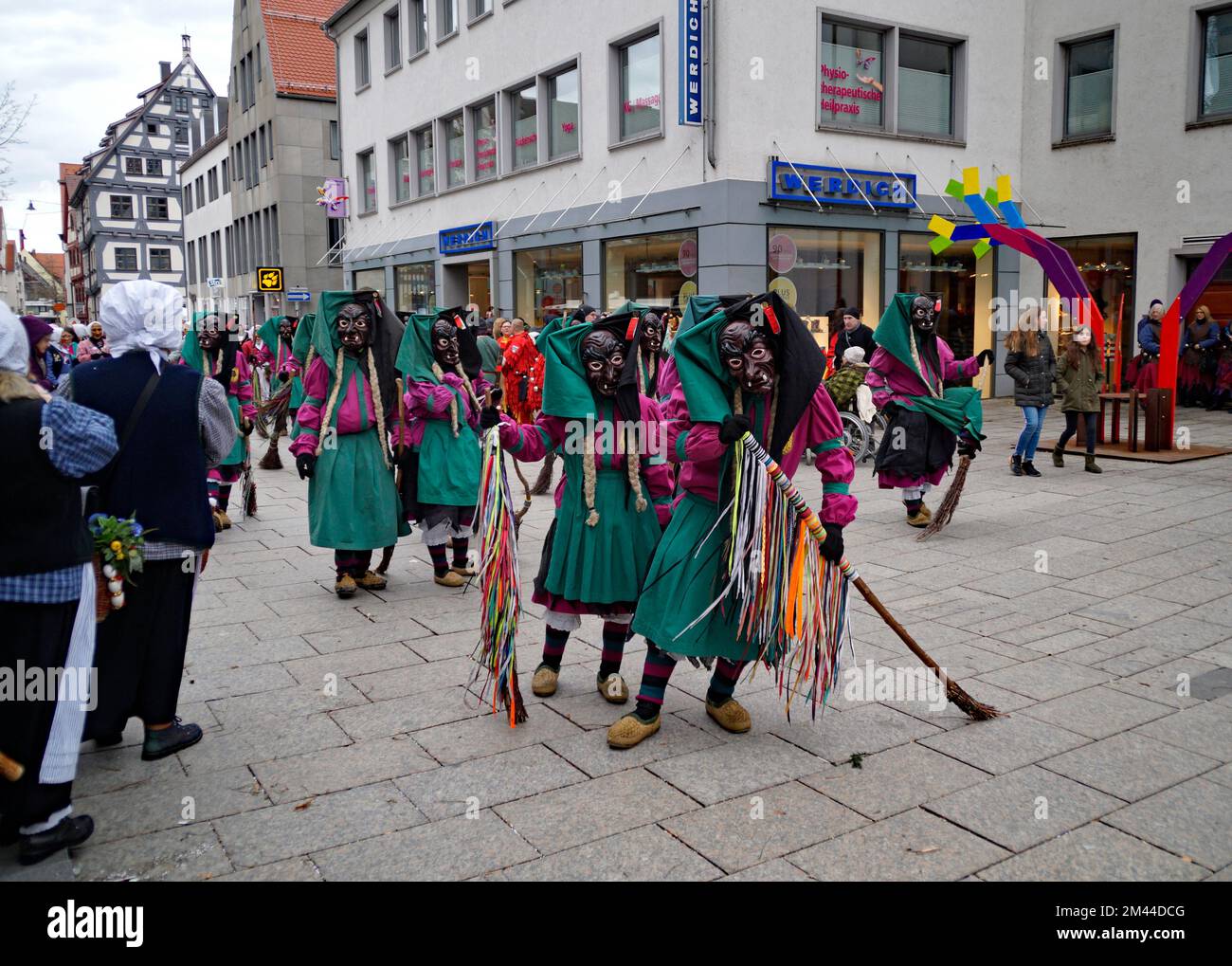 people dressed up in funny clothes and masks celebrating traditional ...