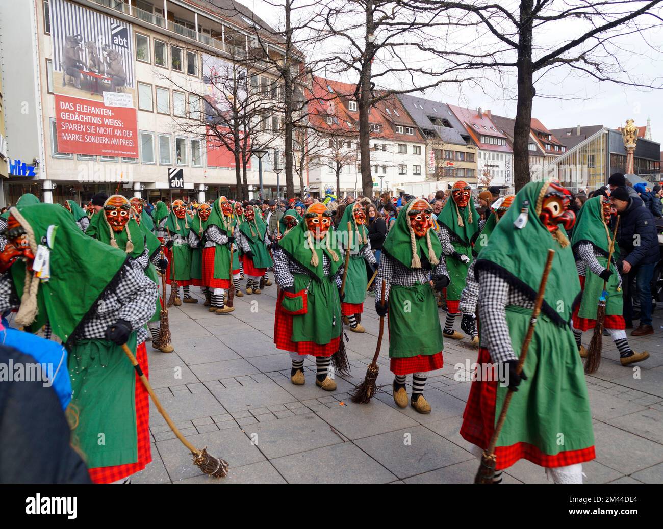 people dressed up in funny clothes and masks celebrating traditional ...