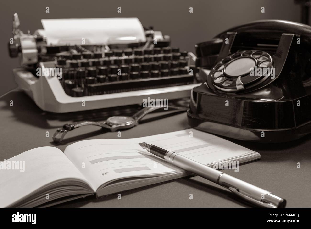 Checkbook with blank page. Retro concept with old phone, ink pen and ...