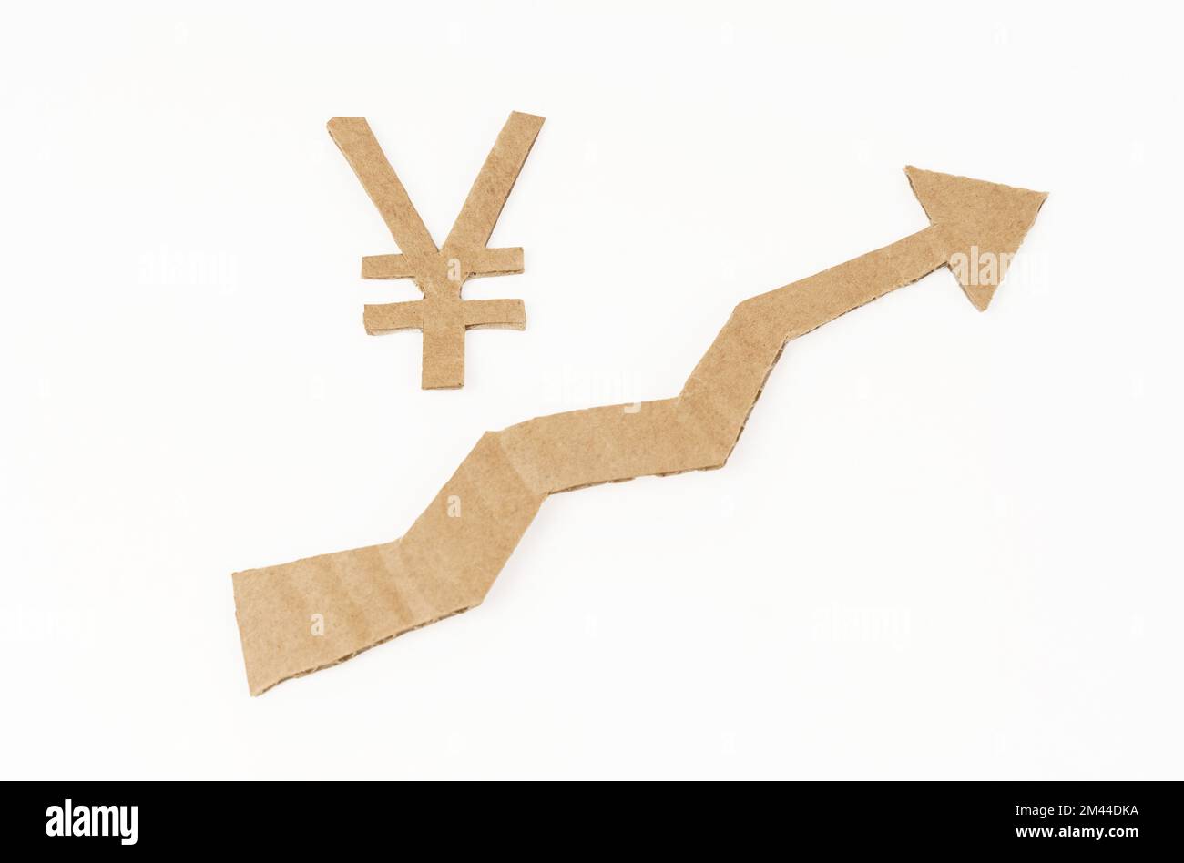 The concept of economic growth. On a white surface is a chart with an up arrow and a yen symbol ...