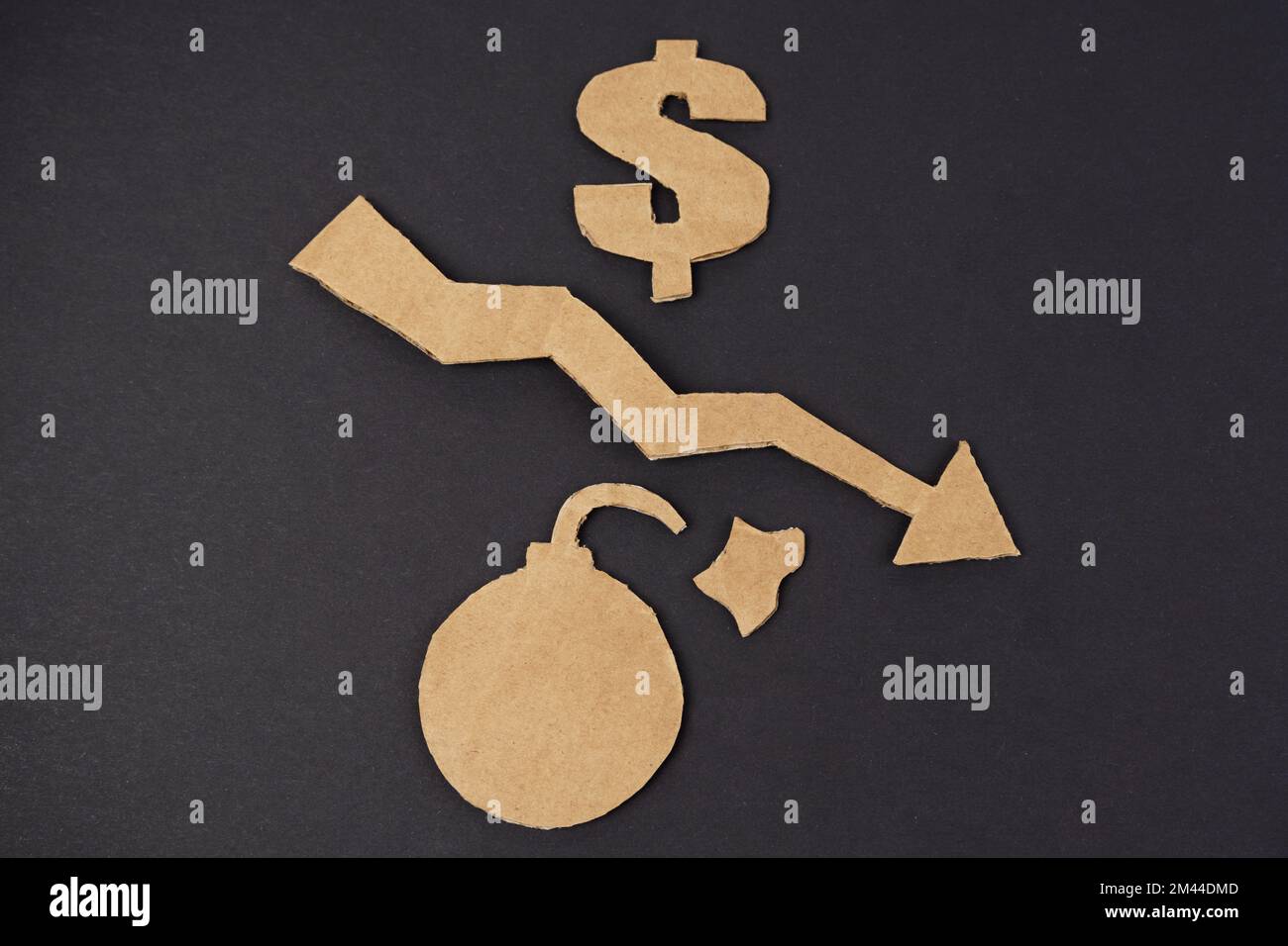 Concept of economic crisis. On a black surface, a graph with a down ...