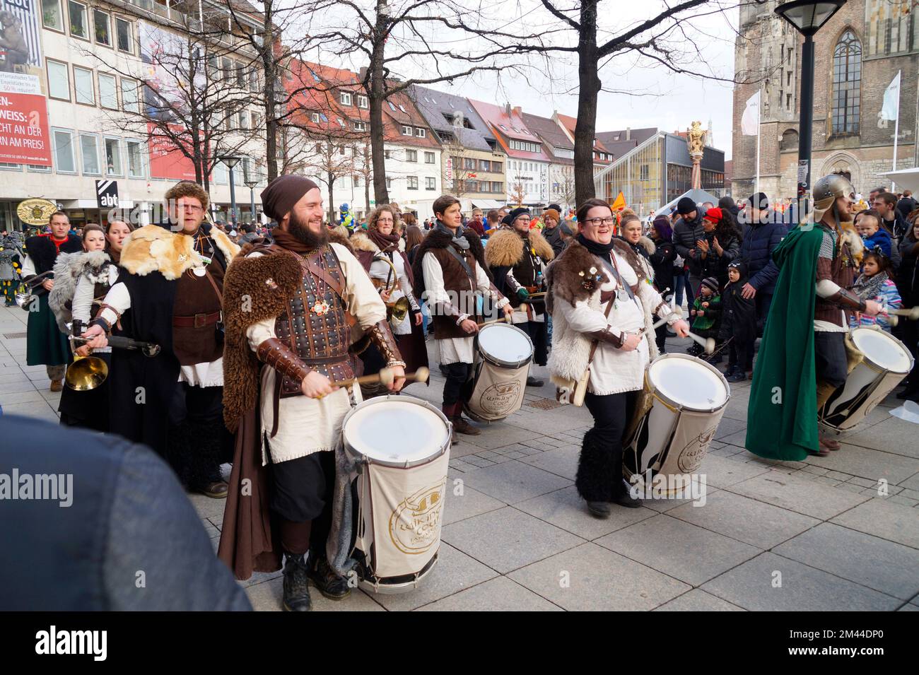 people dressed up in funny clothes and masks celebrating traditional ...