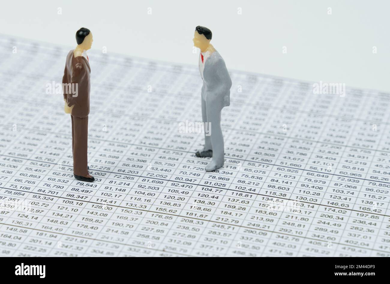 Business concept. There are miniature figures of businessmen on ...