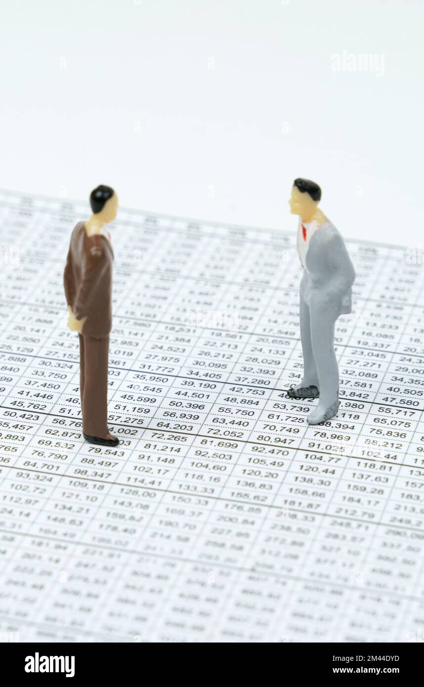 Business concept. There are miniature figures of businessmen on ...