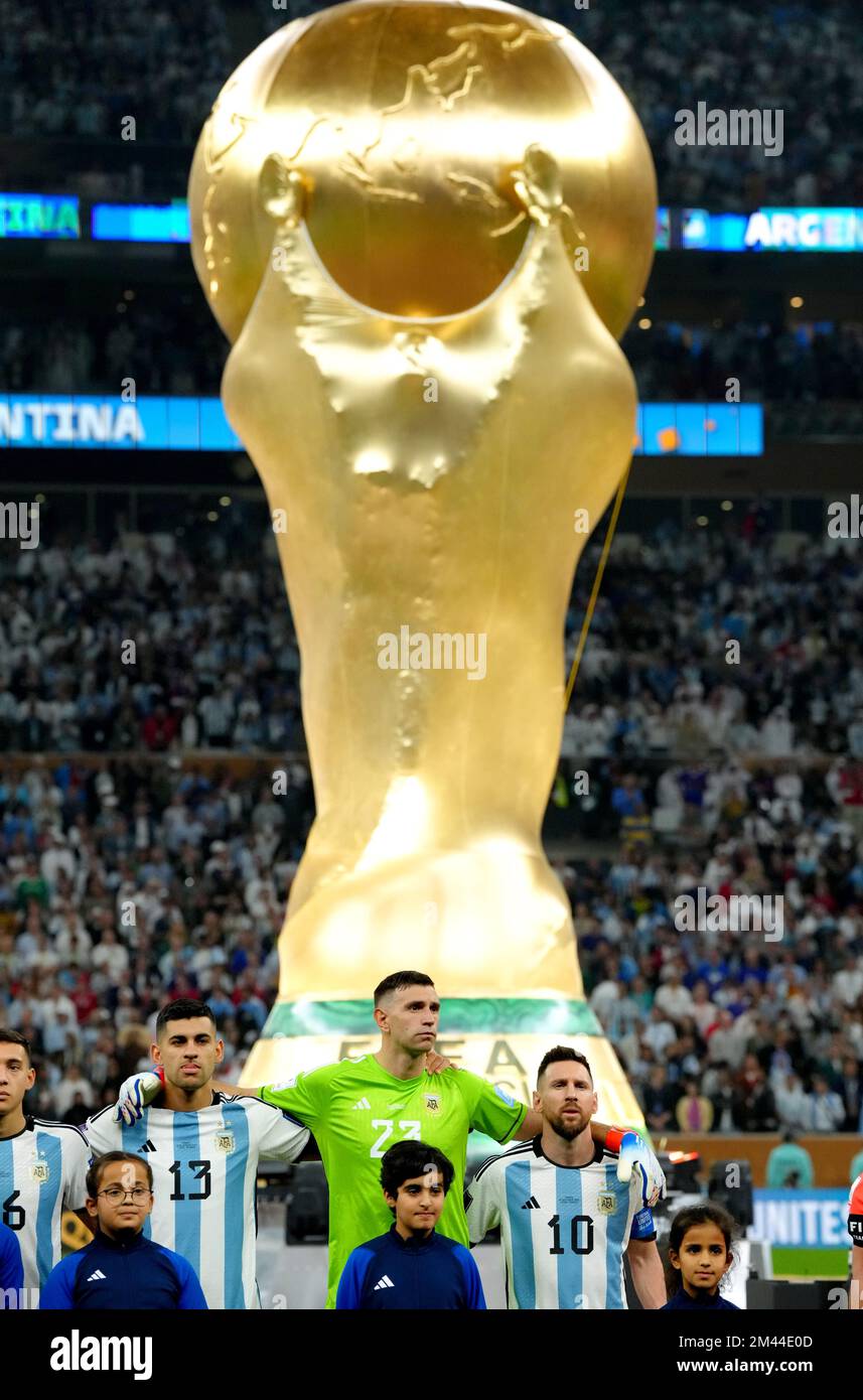Argentina's Cristian Romero, goalkeeper Emiliano Martinez and Lionel Messi stand in front of a ...