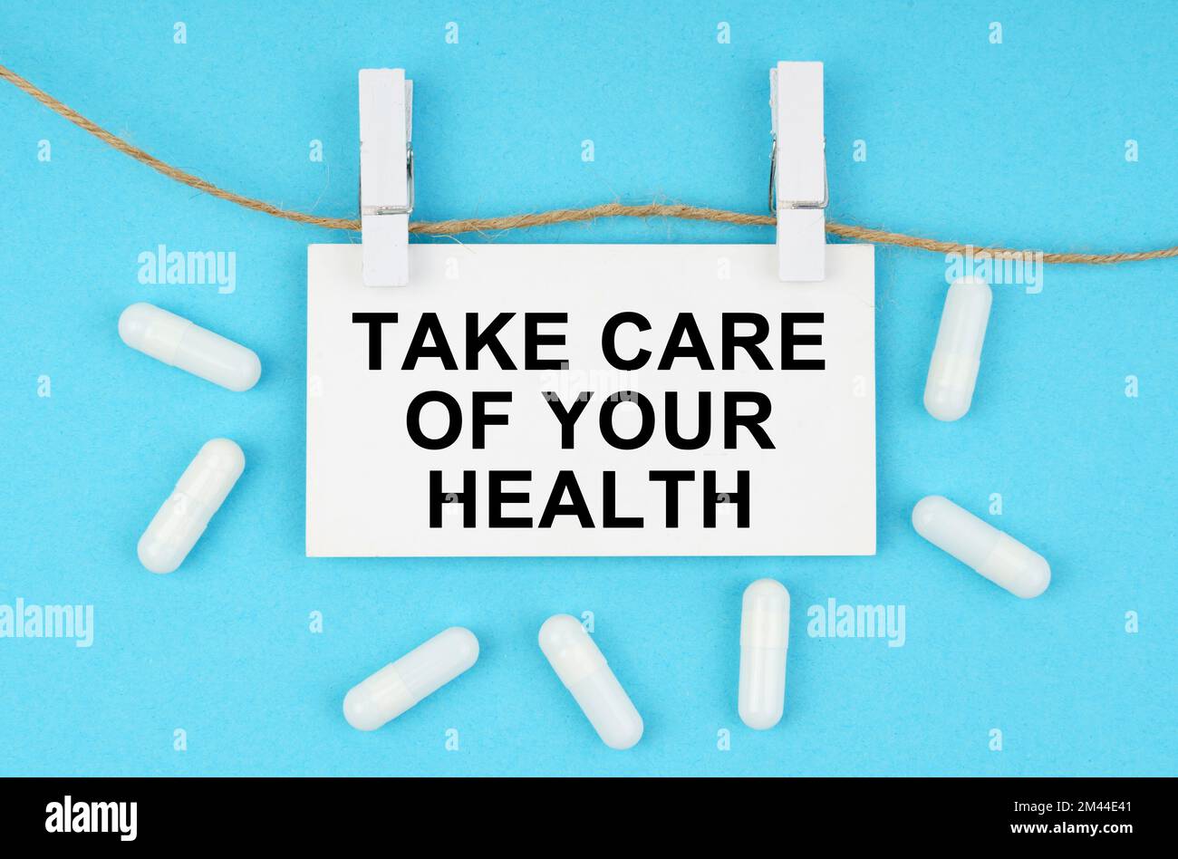 Medical concept. On a blue surface, on a rope with paper clips, there ...