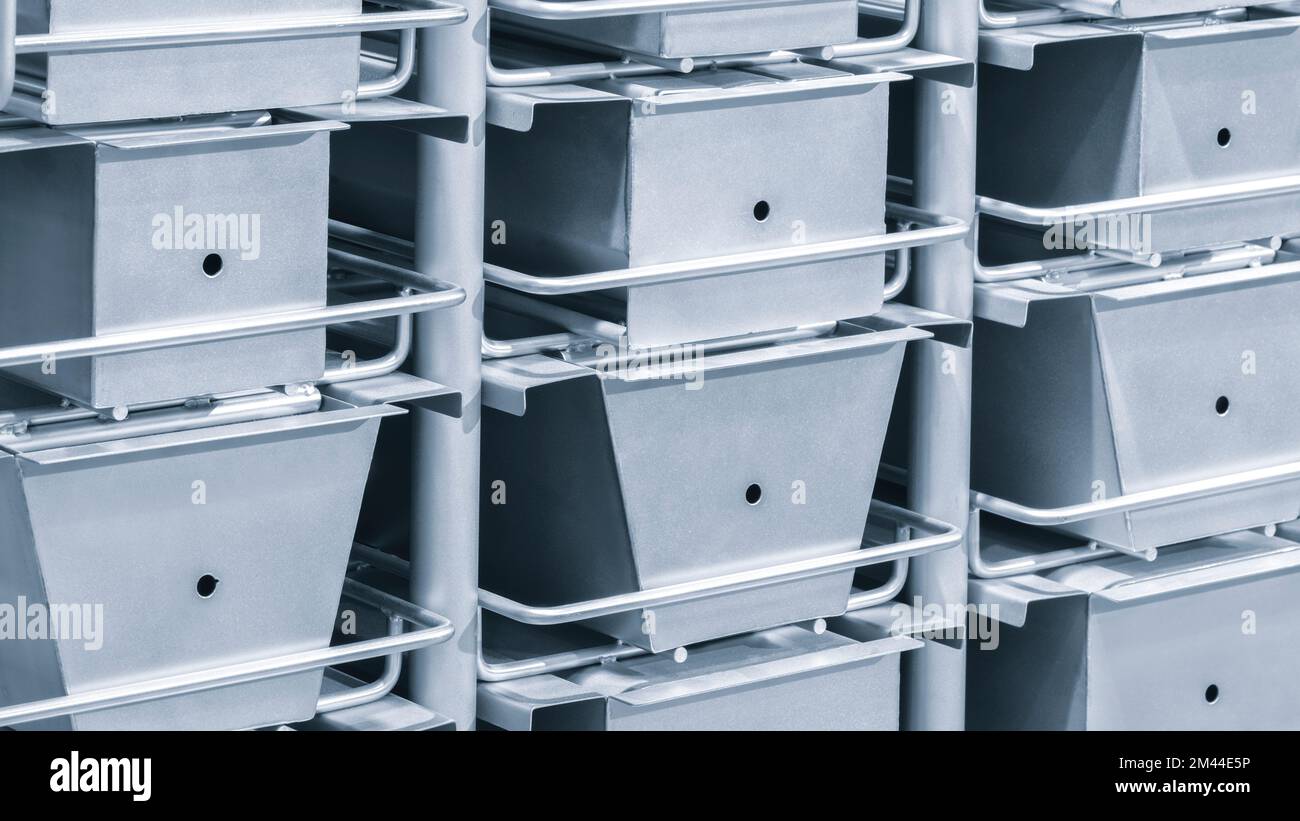 Rack with metal containers for cooking food Stock Photo - Alamy