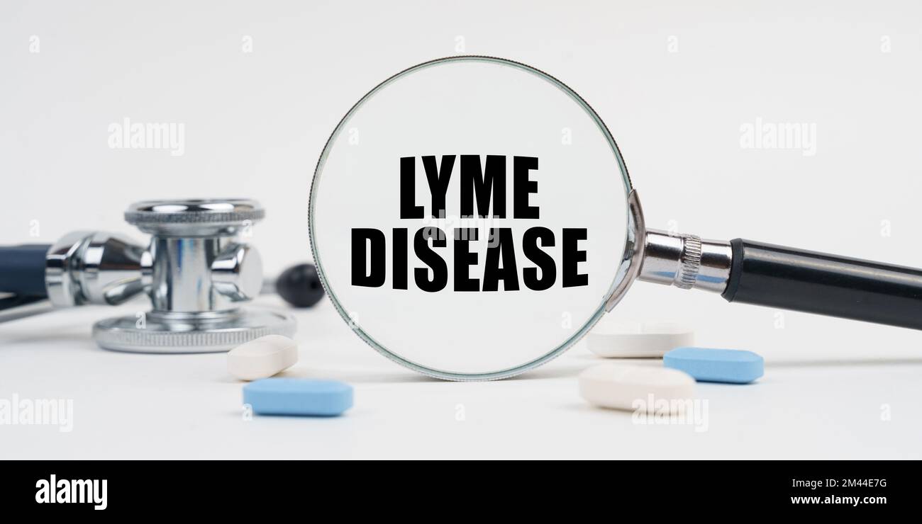 Medicine and health concept. On a white surface lie pills, a ...