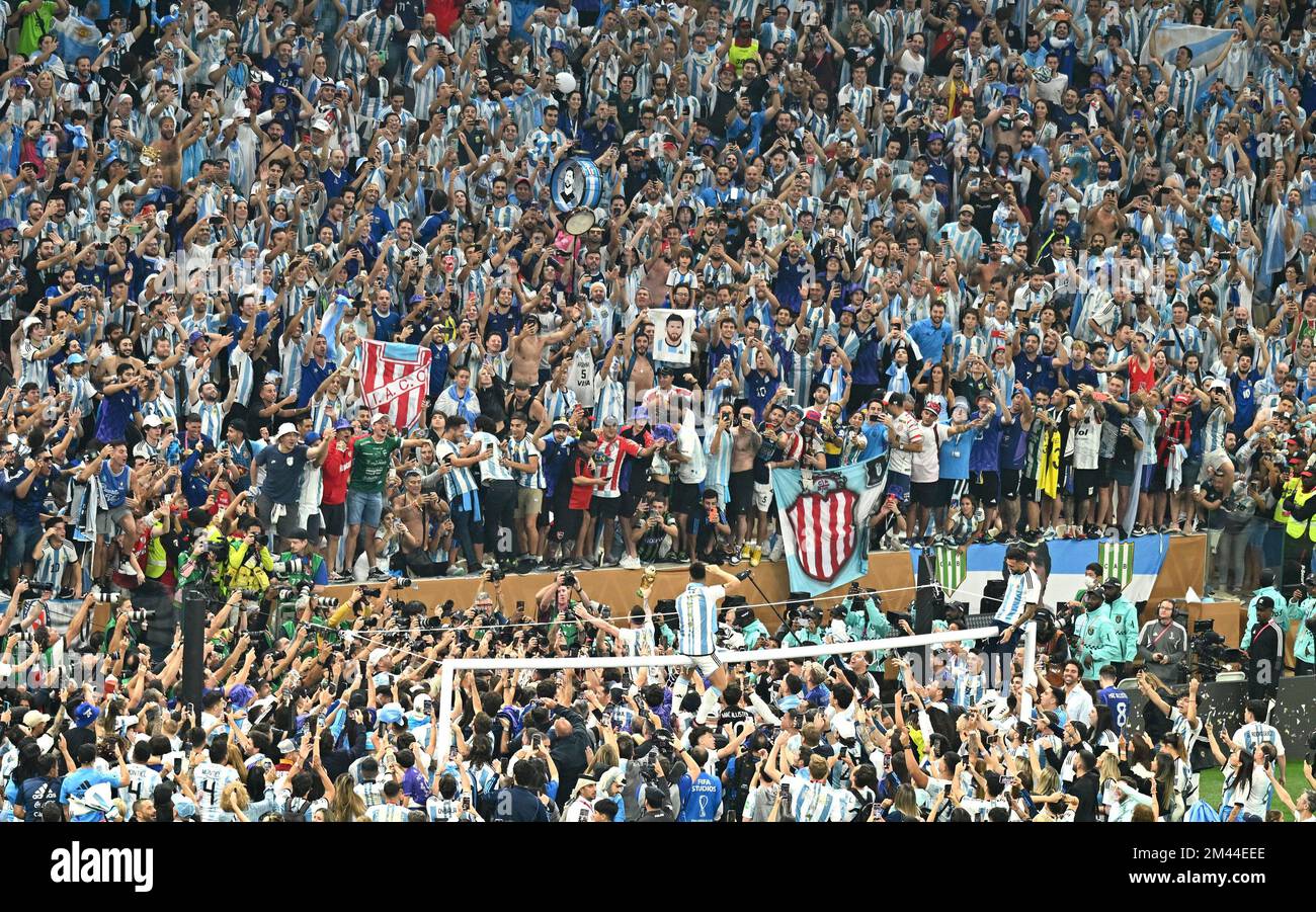 Lusail, Qatar. 18th Dec, 2022. Fans and players of Argentina celebrate ...