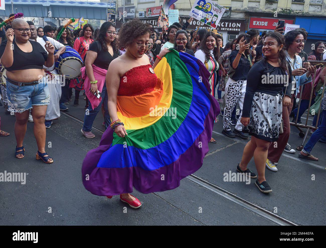 Kolkata, India. 18th Dec, 2022. A participant in a rainbow dress dances ...