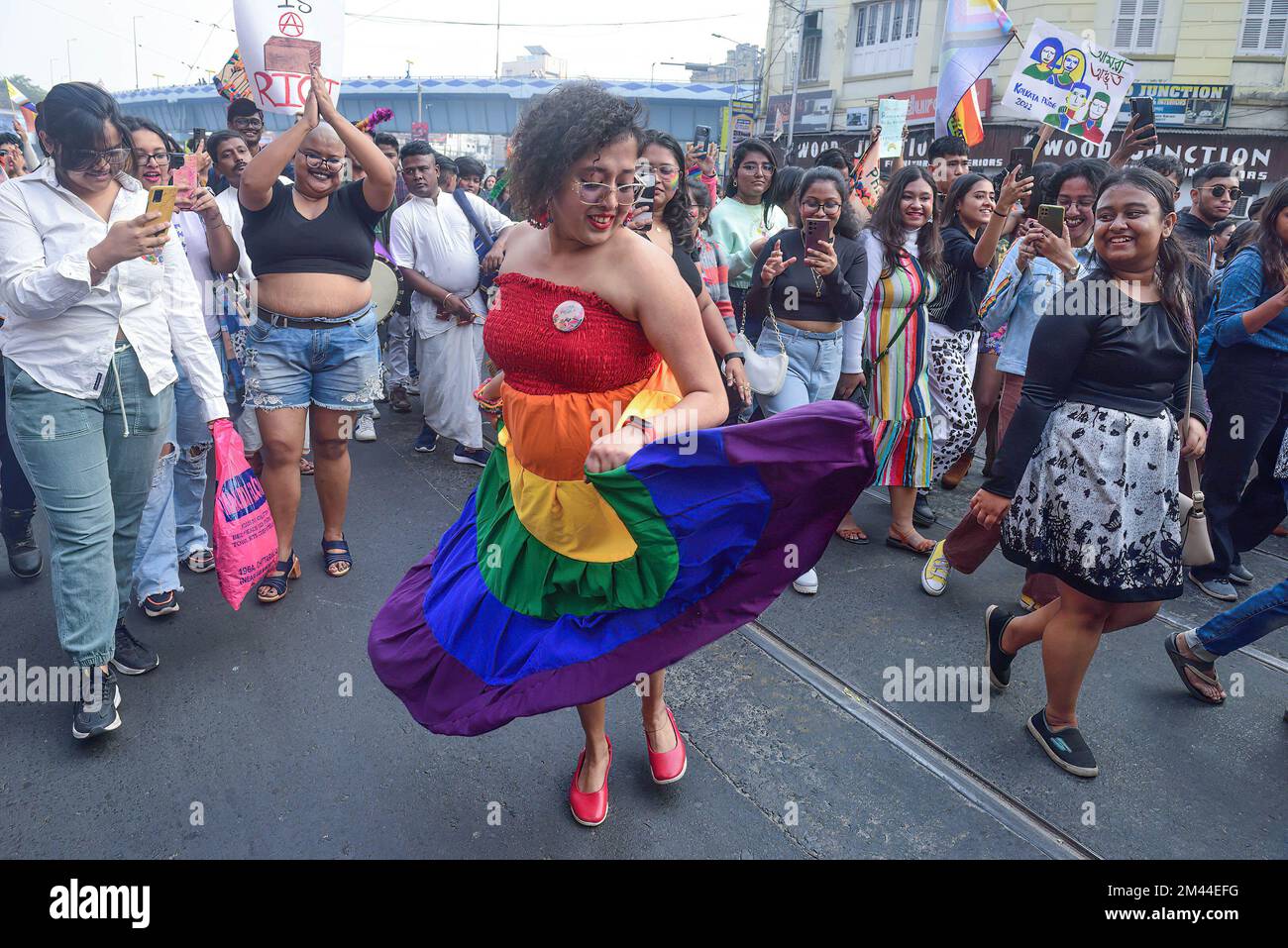 Kolkata, India. 18th Dec, 2022. A participant in a rainbow dress dances ...