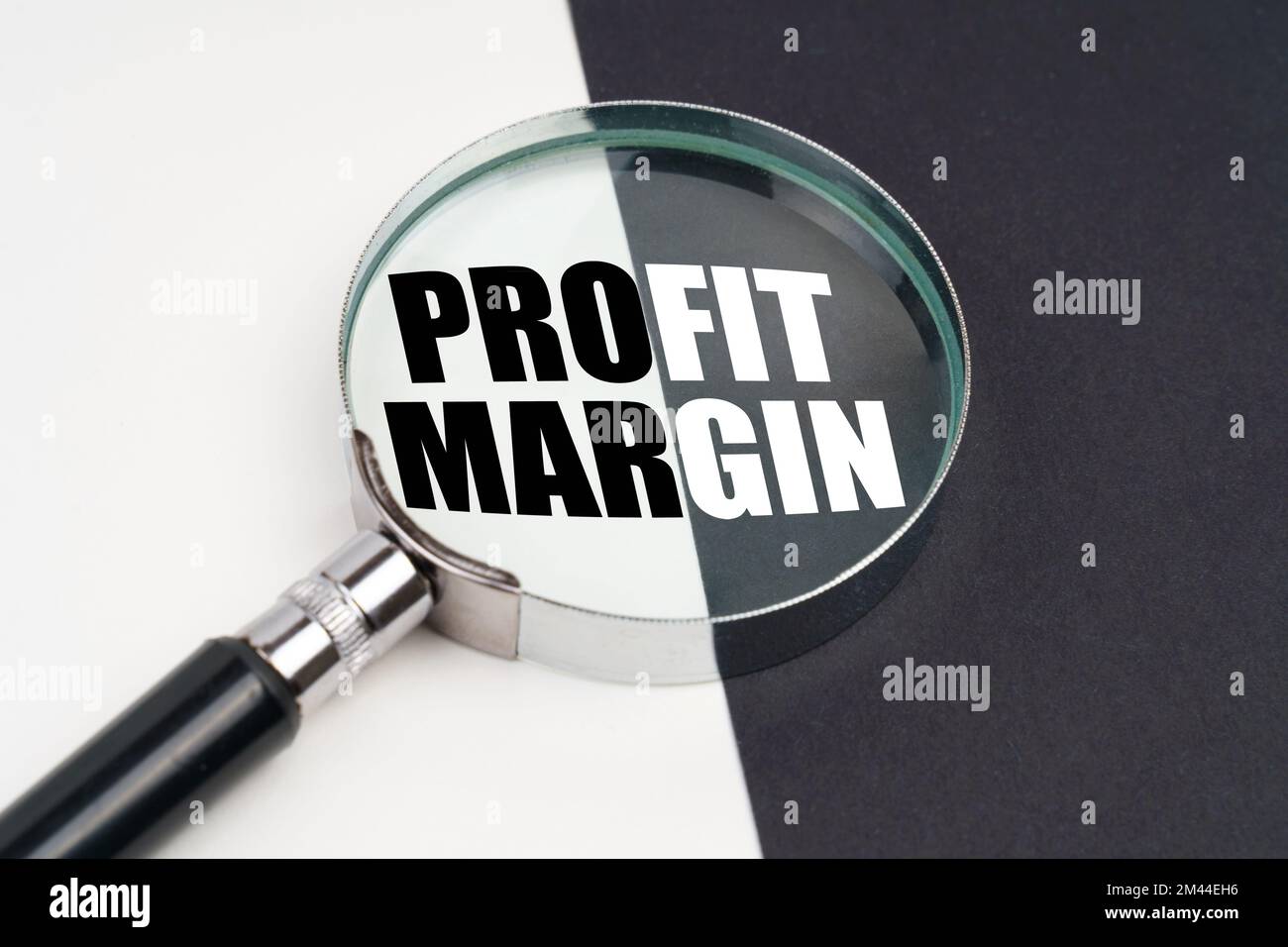 Business concept. On the surface, which is half black and white, lies a ...