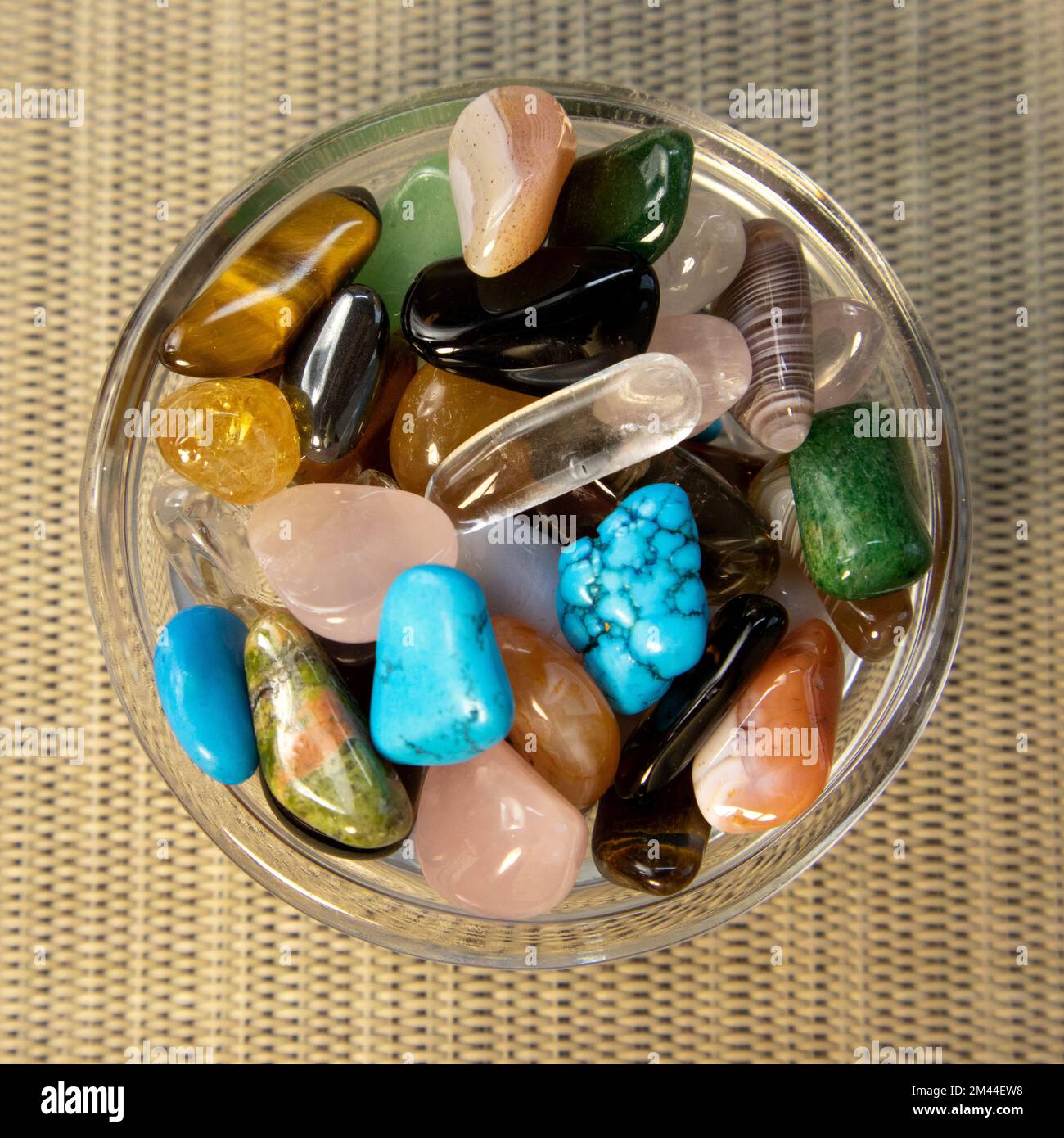 Collection Of Semi-Precious Gemstones on white textured board ...