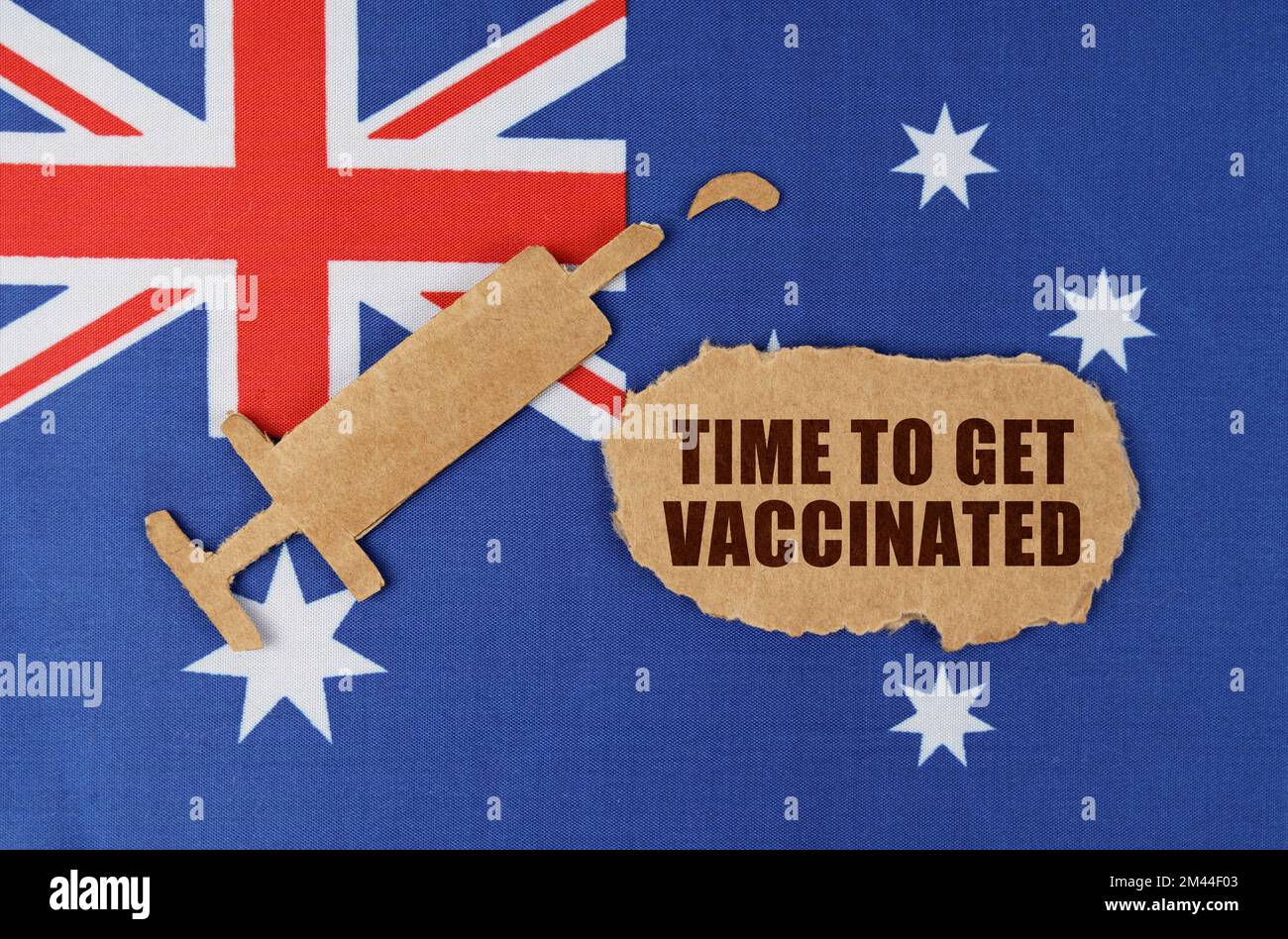 Medical concept. On the flag of Australia there is a cardboard figure ...