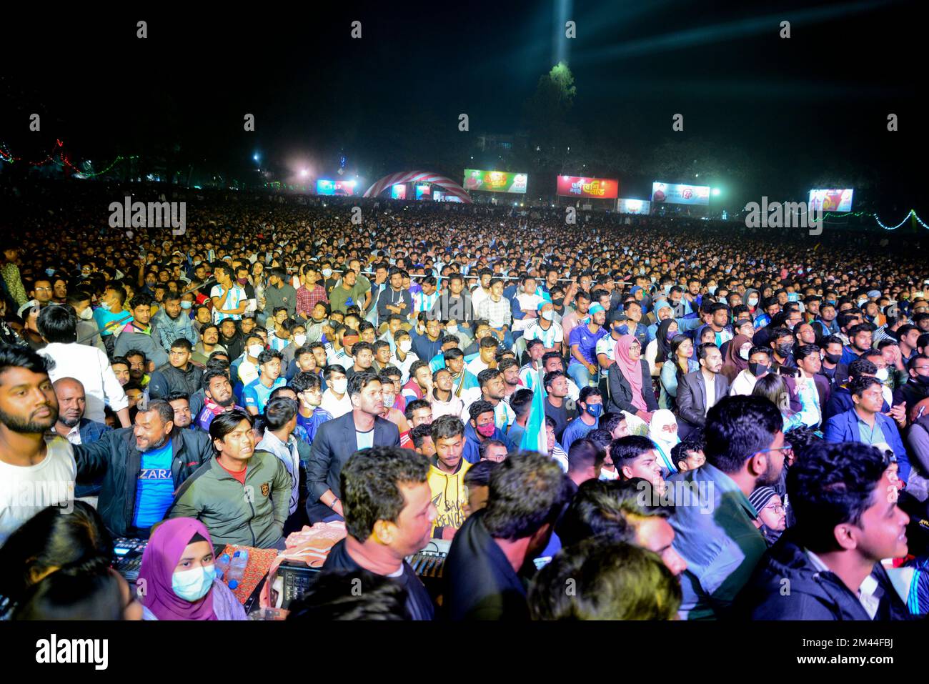 Bangladeshi soccer fans watch on a big screen a public broadcast of the ...
