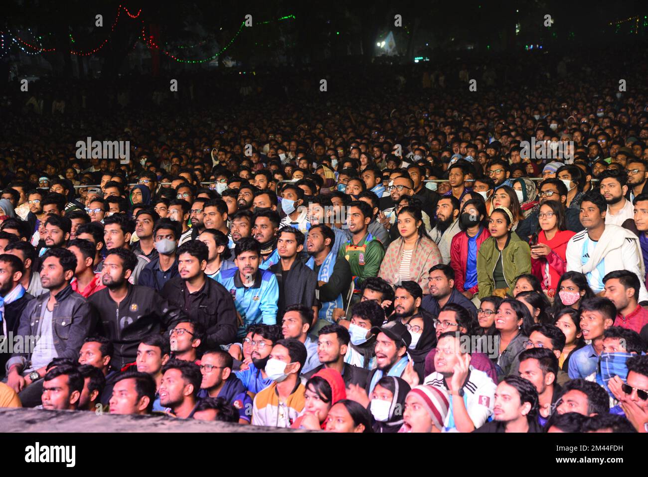 Bangladeshi soccer fans watch on a big screen a public broadcast of the ...